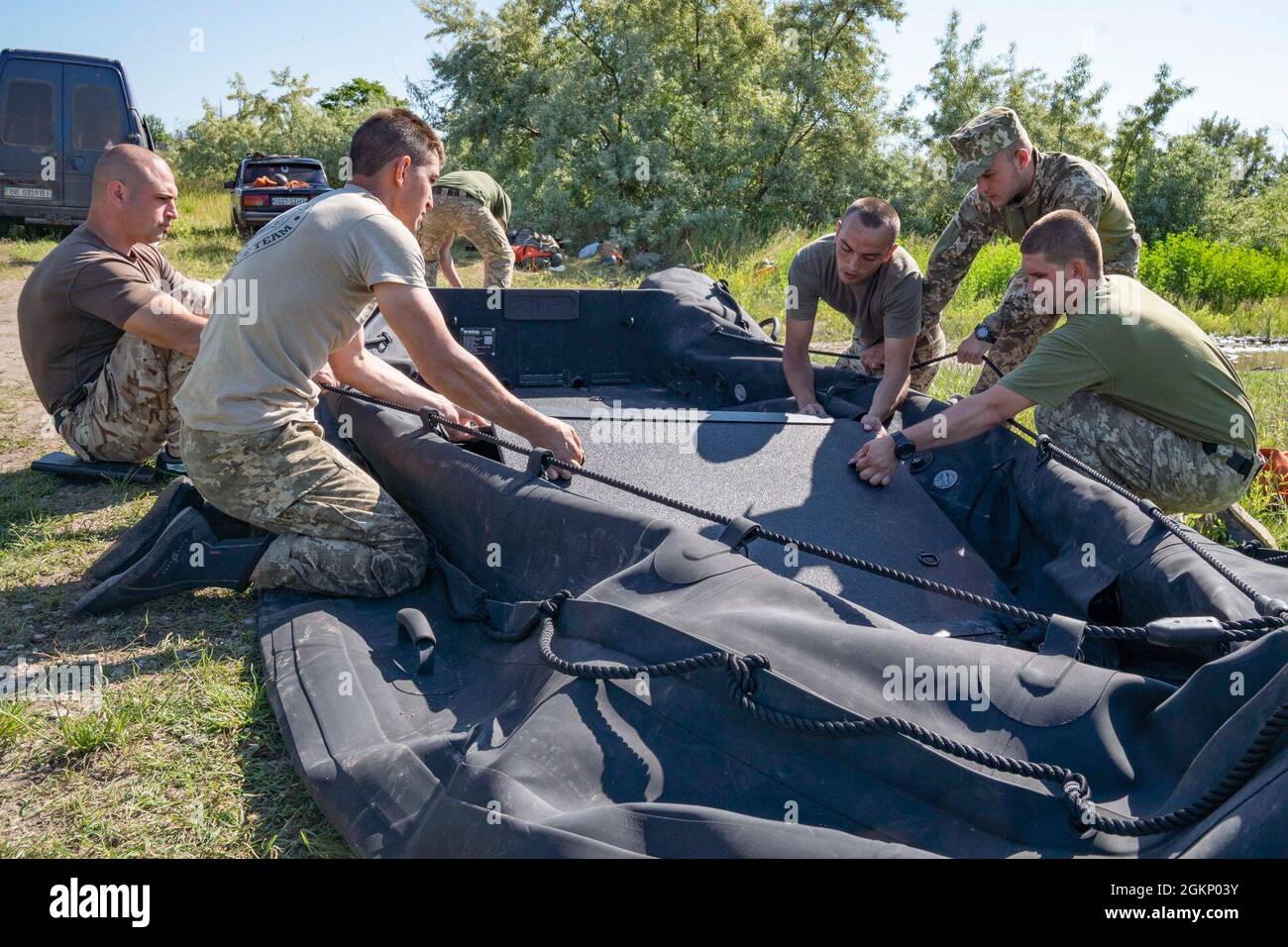 Ukrainian Marines with the 36th Marine Brigade assemble a combat rubber ...