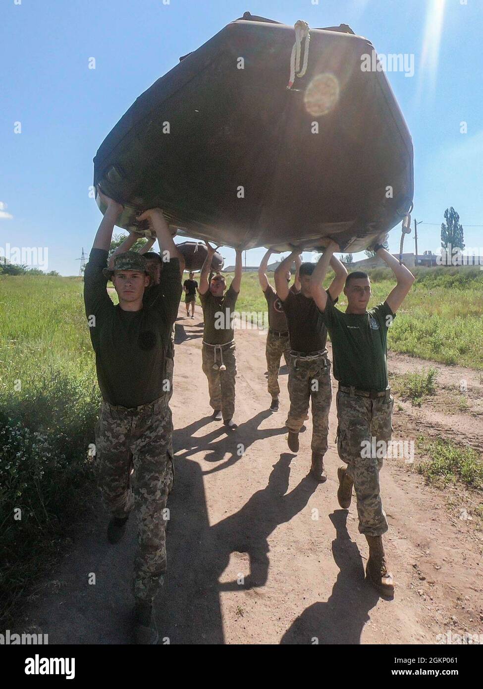Ukrainian Marines with the 36th Marine Brigade carry a combat rubber ...
