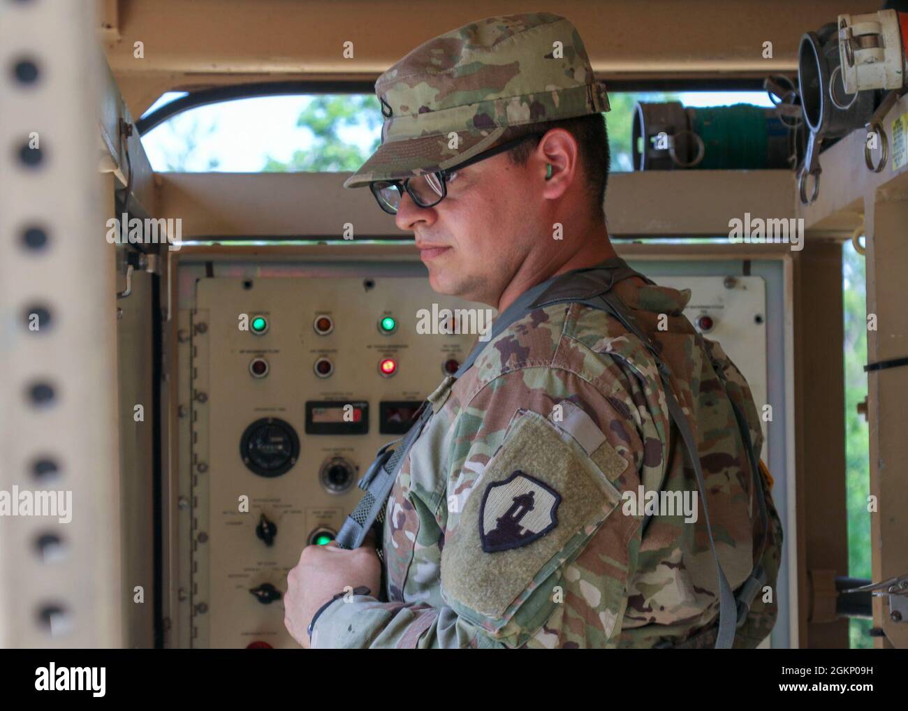 U.S. Army Reserve Pvt. 1st Class Angel Perez, a water purification ...