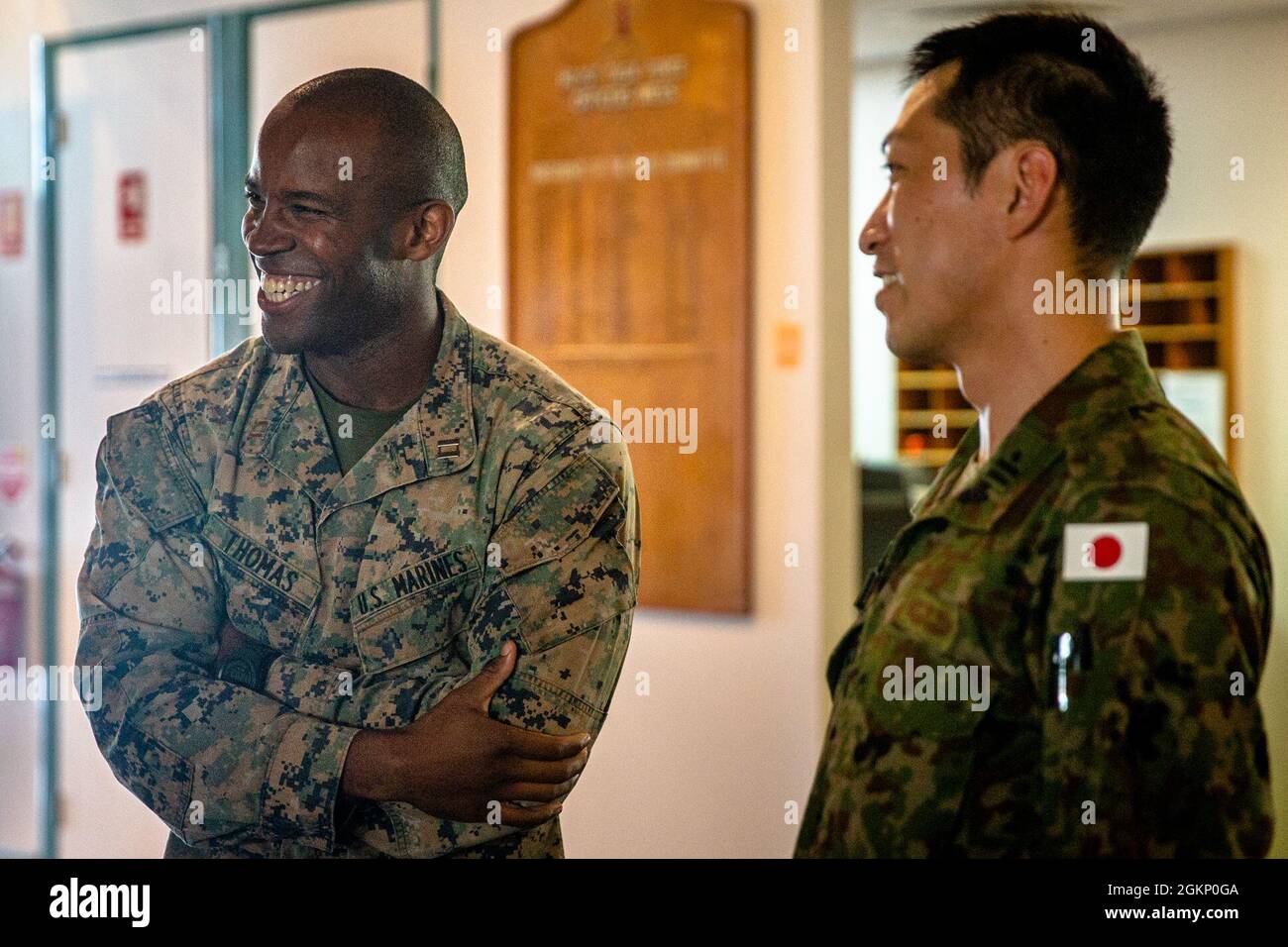 U.S. Marine Corps Capt. Dominique Thomas, left, commanding officer of ...