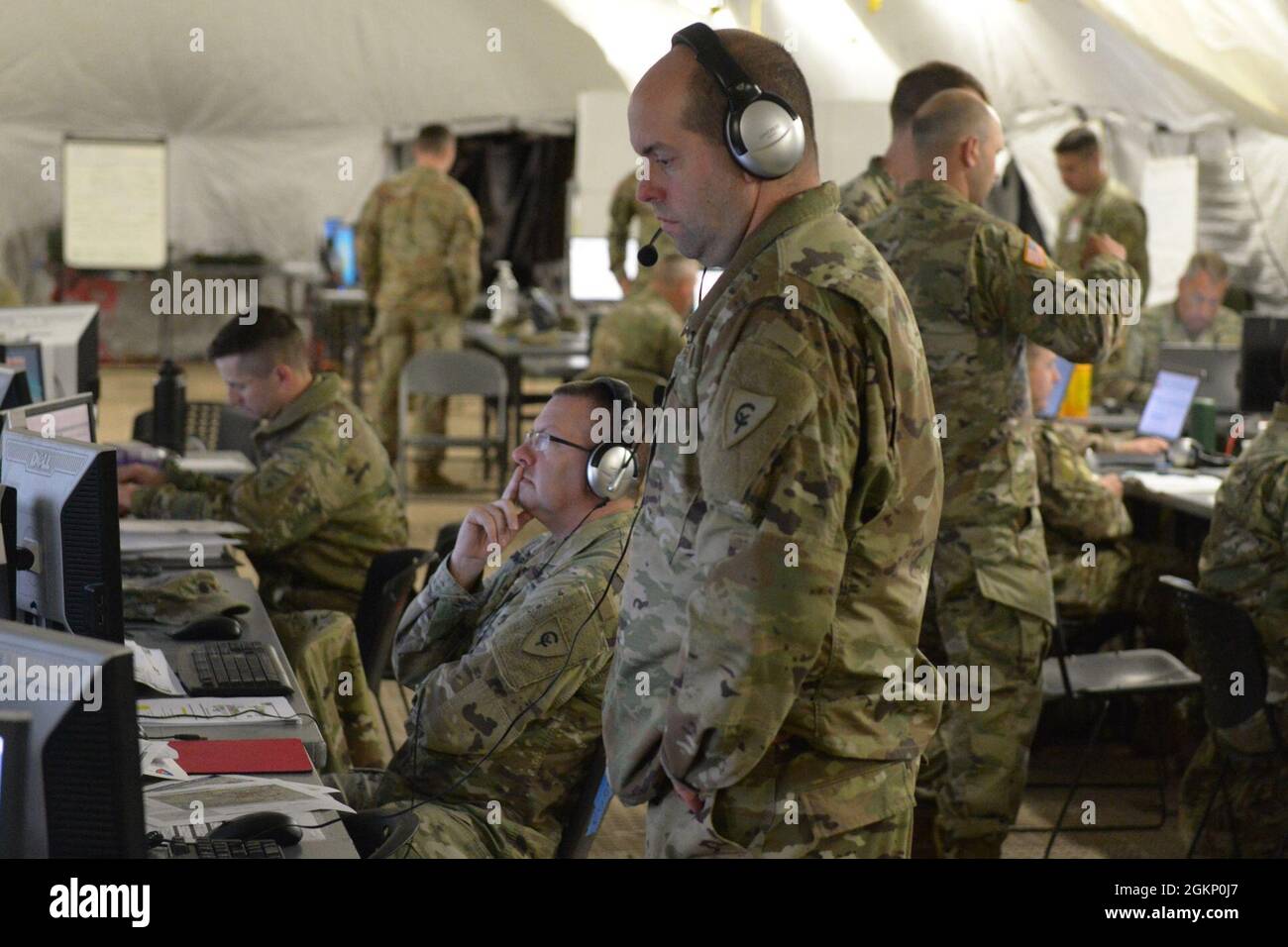 Soldiers with the 38th Infantry Division conduct a battle update brief ...