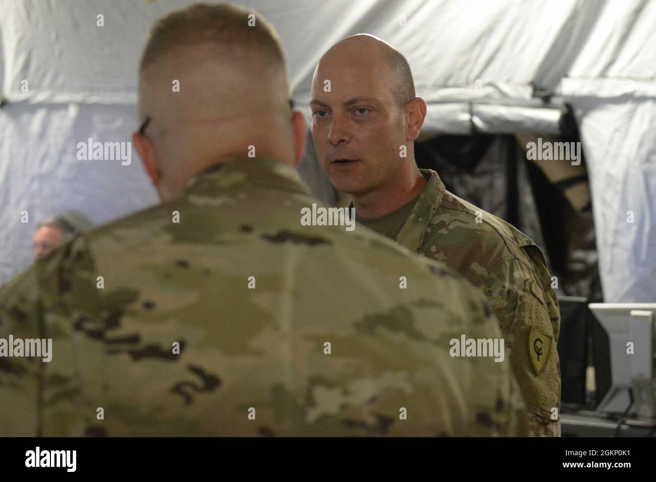 Indiana National Guard Master Sgt. Thomas Burress, right, of Evansville ...