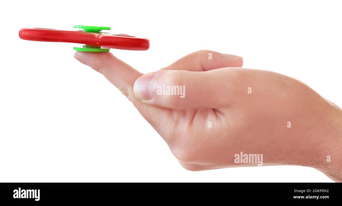 Man holding modern spinner on white background Stock Photo - Alamy