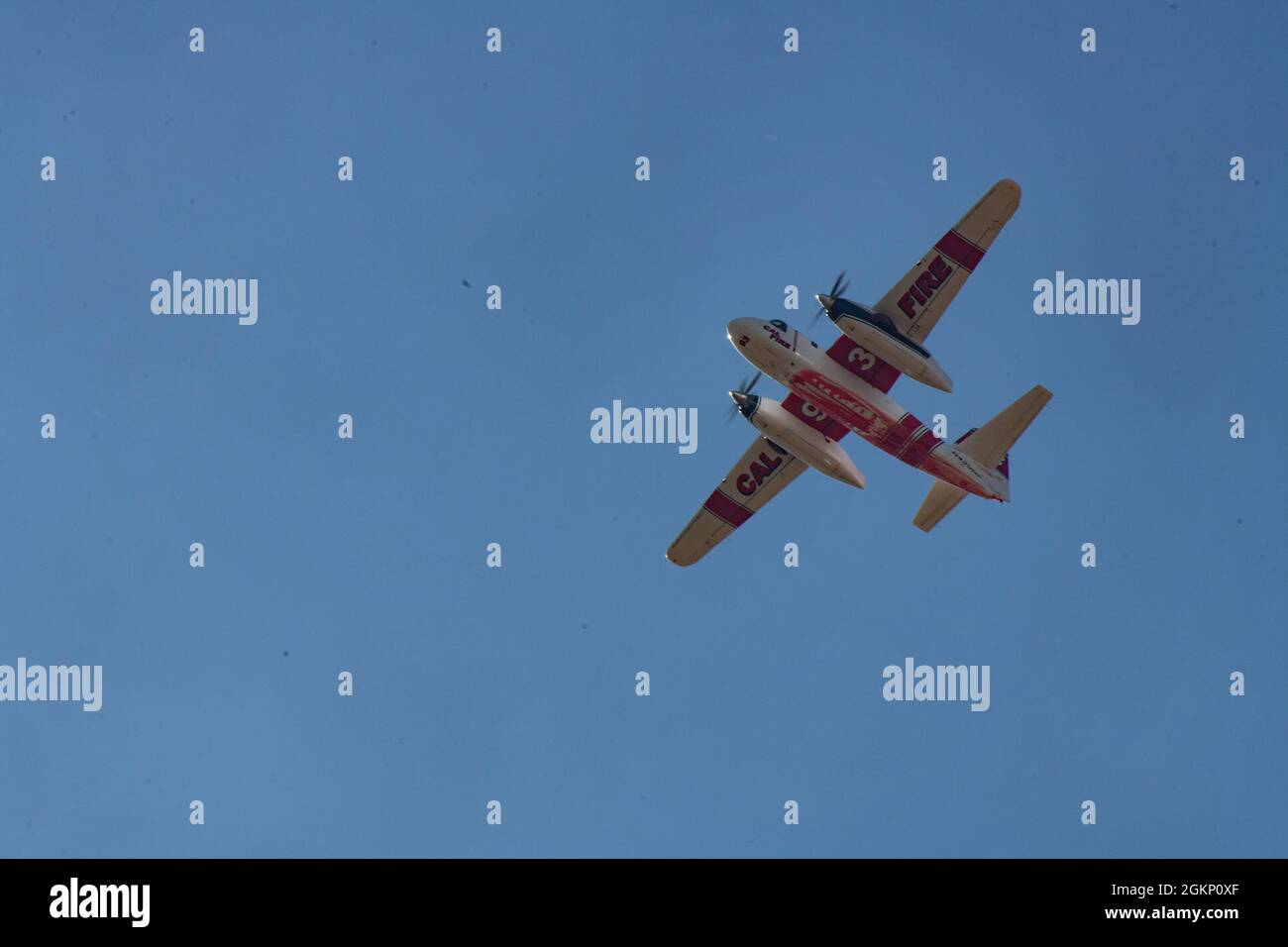 A Cal Fire S-2T Airtanker prepares for an aerial fire retardant drop to ...