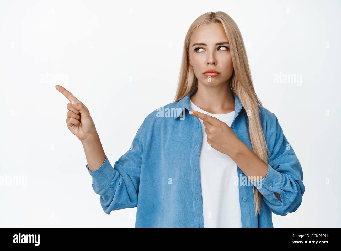 Portrait of upset beautiful girl look with regret, pointing and looking ...
