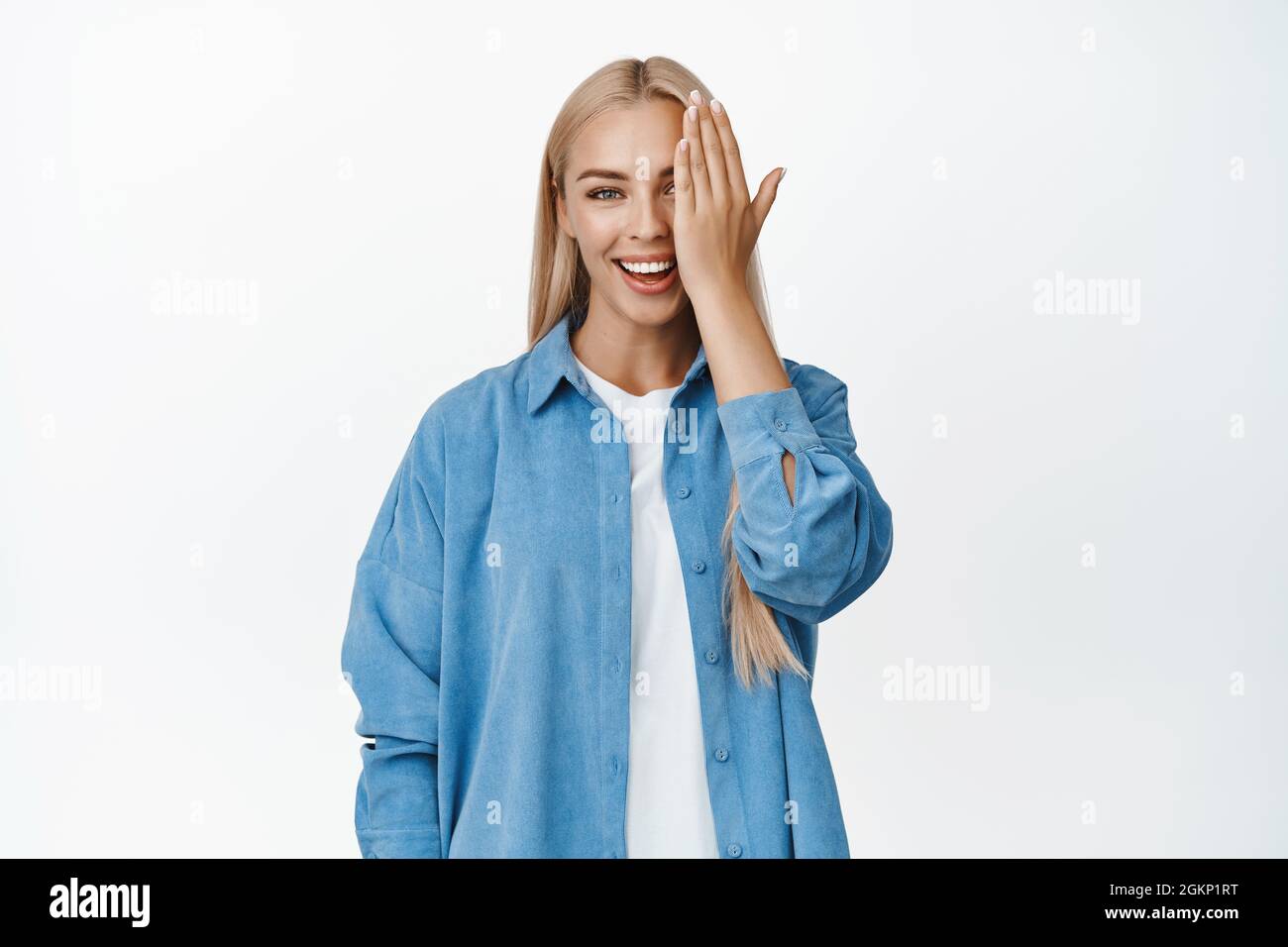 Portrait of attractive smiling woman with blond hair and white smile ...