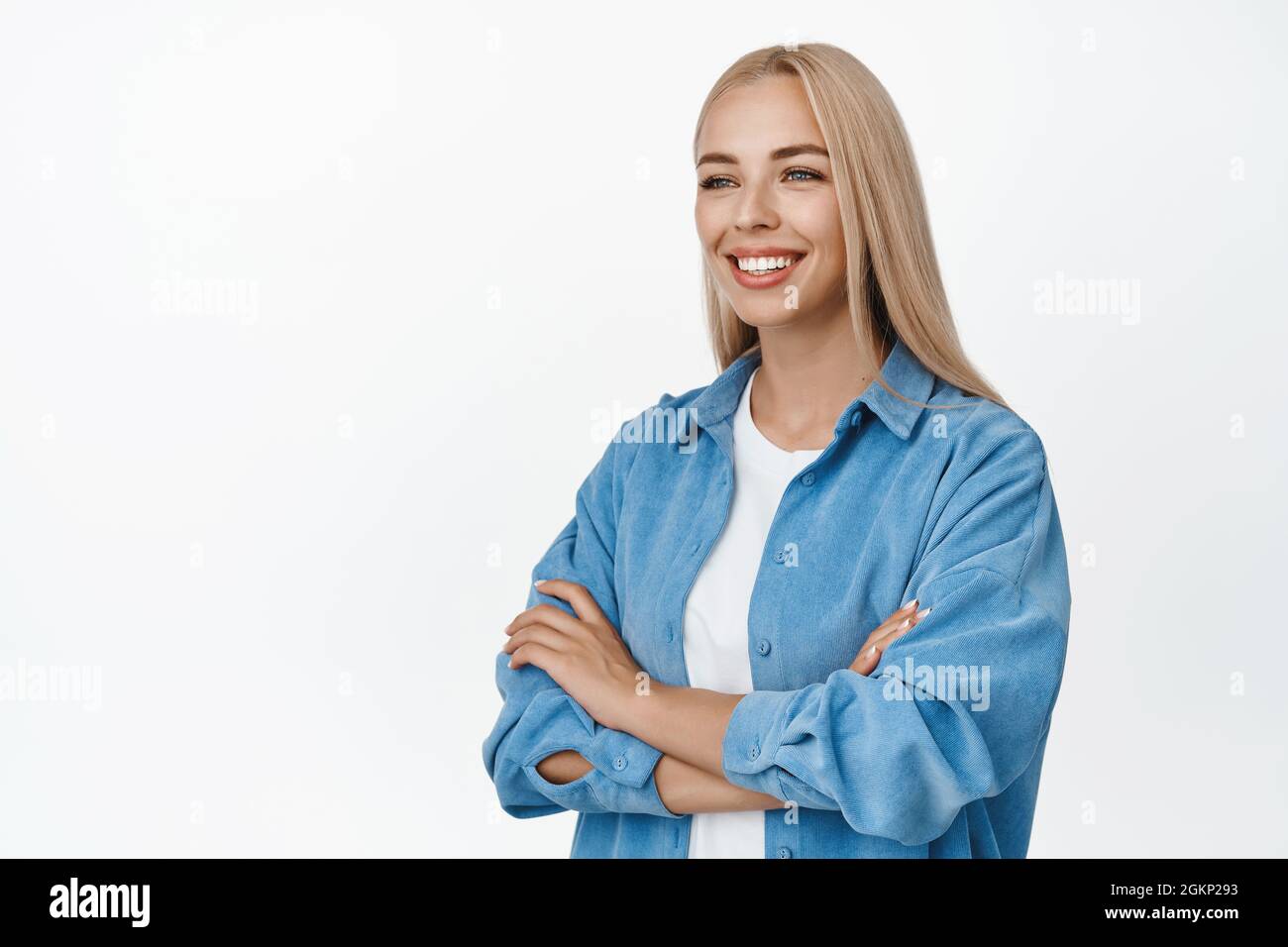 Portrait of attractive blond woman looking hopeful aside at logo, cross ...