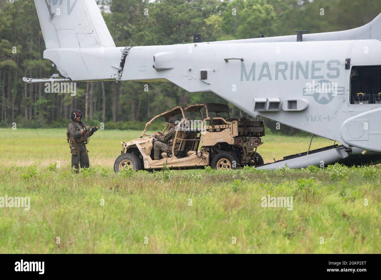 U.S. Marines with 1st Battalion, 2nd Marine Regiment load a Utility ...