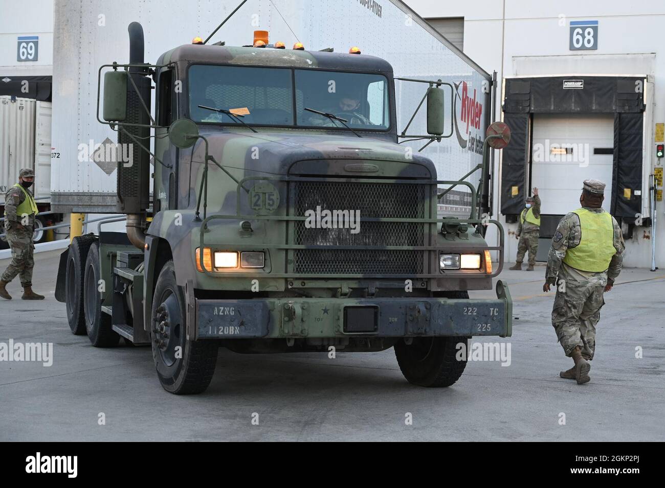 Arizona National Guard service members dock an M915 Line-Haul Tractor ...