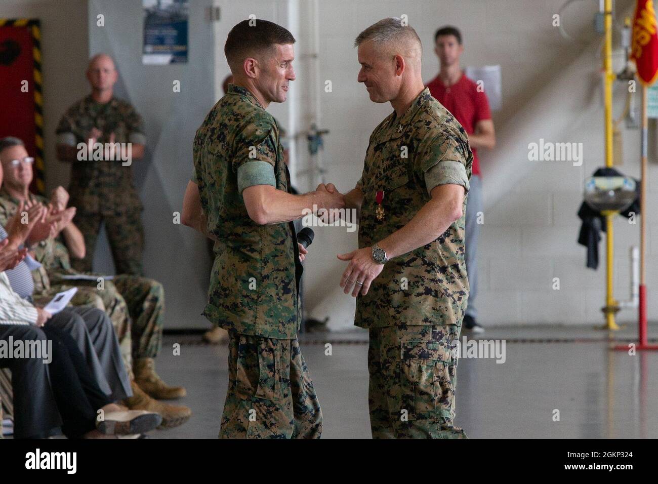 U.S. Marine Corps Col. Robert B. Finneran, right, shakes Col. Richard D ...