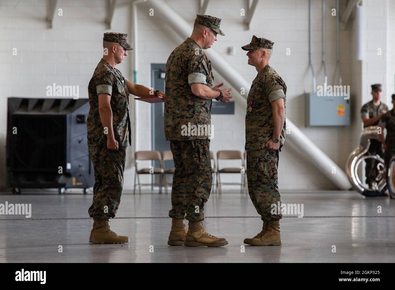 U.S. Marine Corps Maj. Gen. Michael S. Cederholm, center, awards Col ...