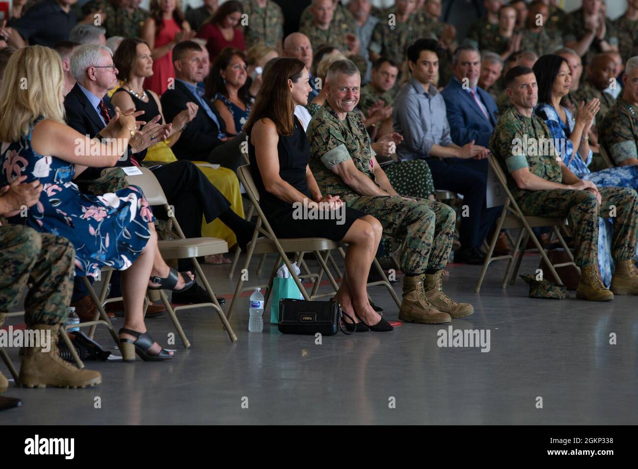 U.S. Marine Corps Col. Robert B. Finneran, center, is applauded during ...