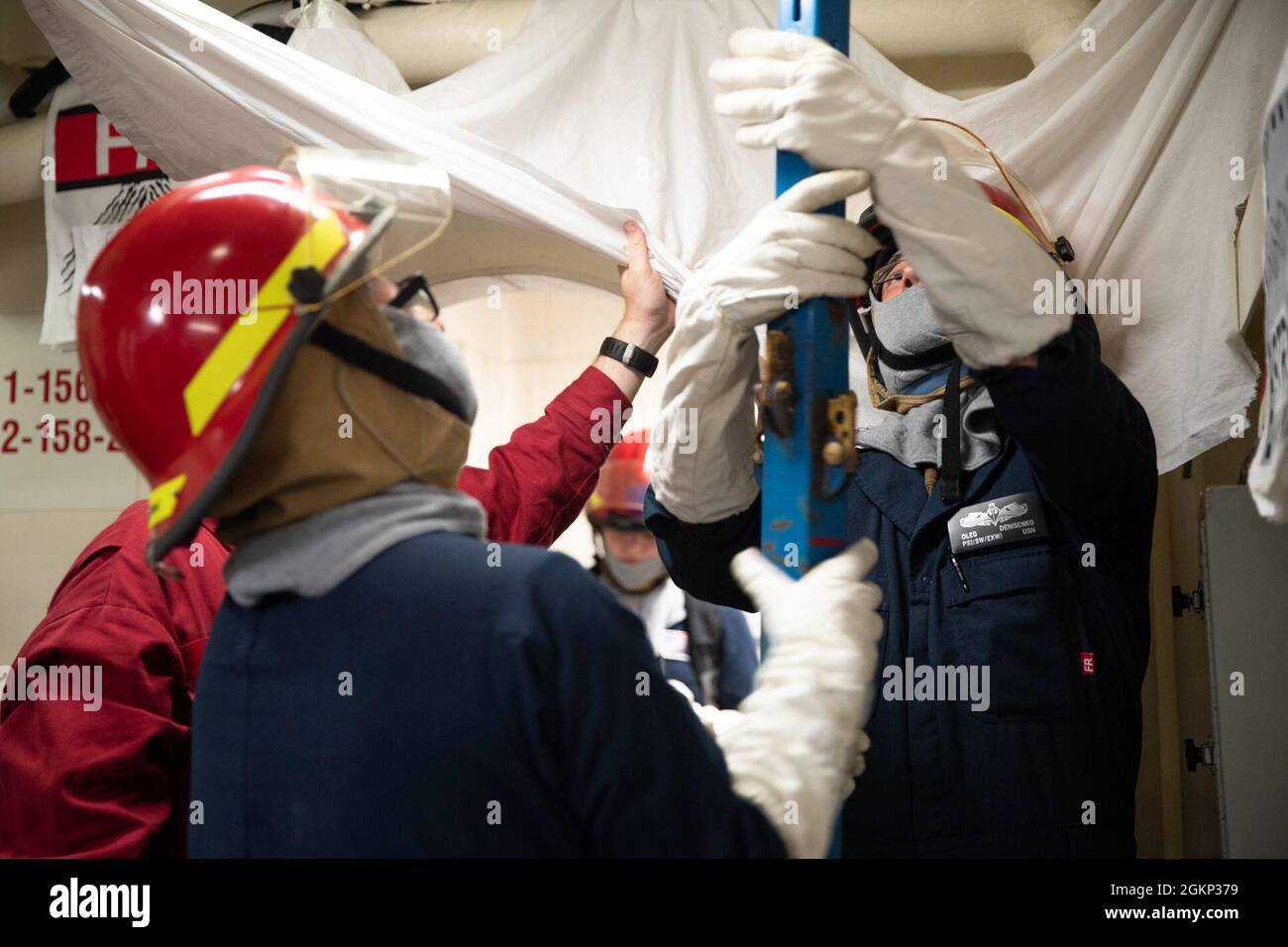 Sailors assigned to one of USS Gerald R. Ford's (CVN 78) repair lockers ...