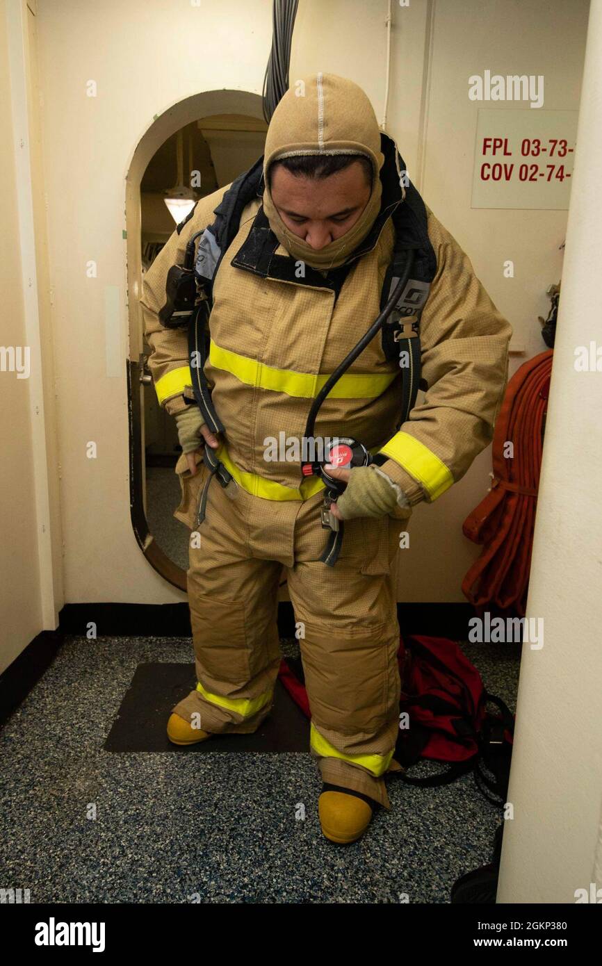 Damage Controlman Fireman Francisco Ruiz, from San Diego, assigned to ...