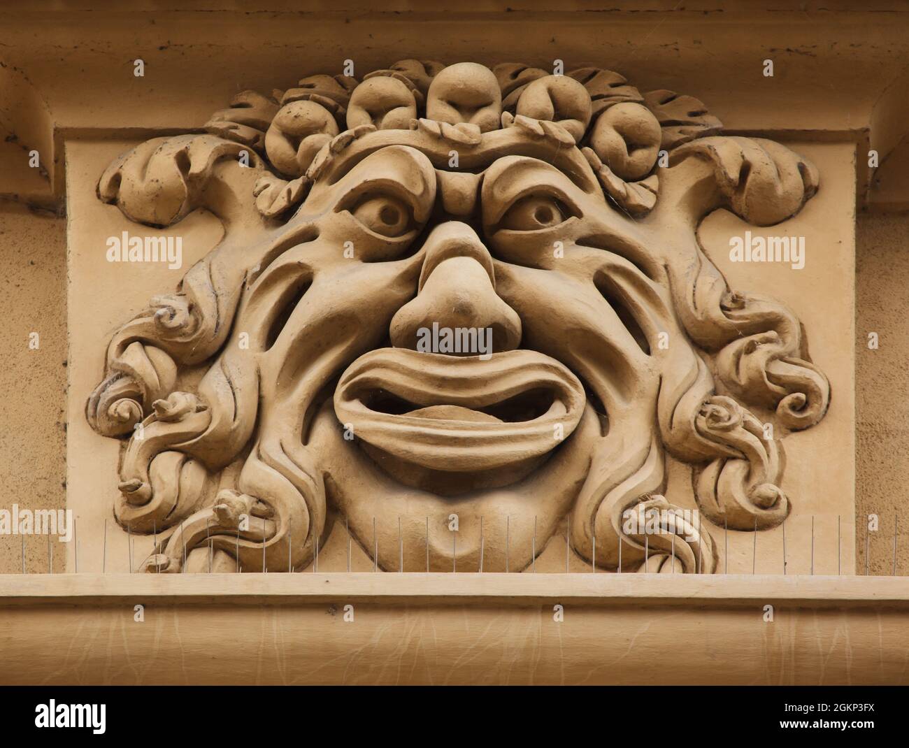 Baroque mascaron on the west facade of the Clementinum (Klementinum) in ...