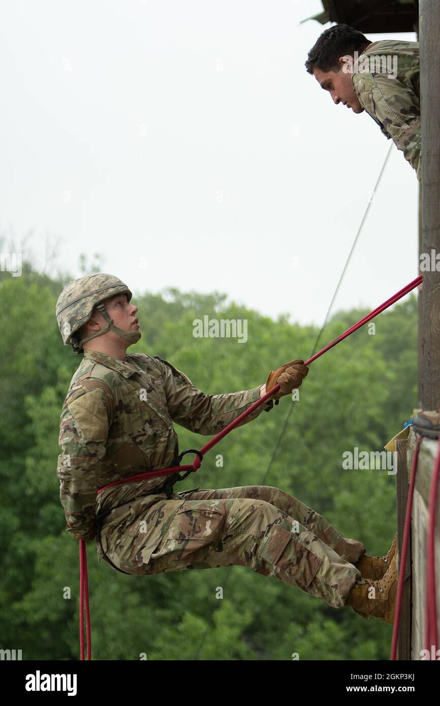 A rappelling Cadet gets instructions from a Cadre member during Cadet ...