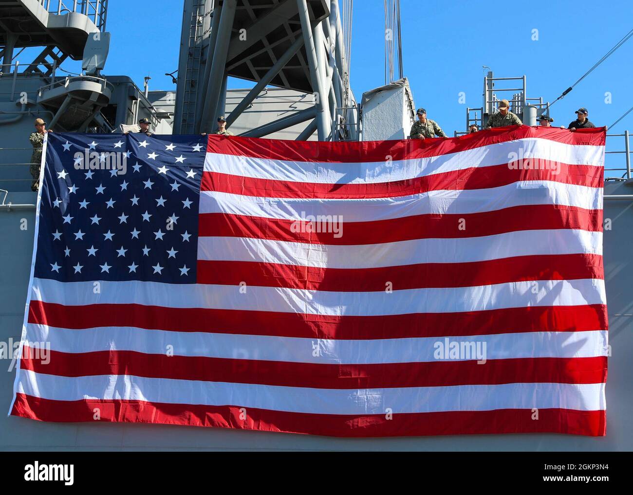 210610-N-NM271-1050 SAN DIEGO (June 10, 2021) – Sailors drape a ...