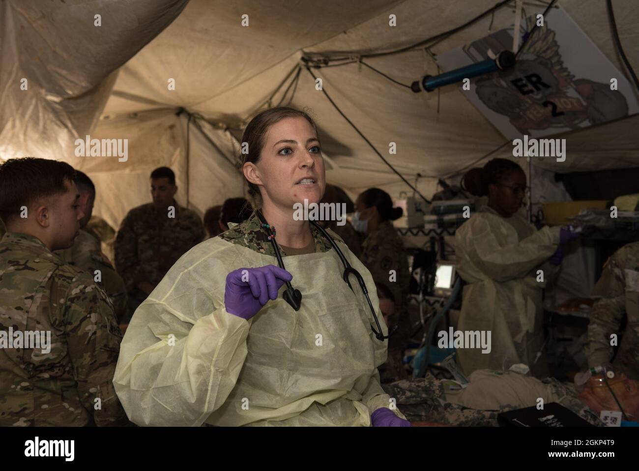 ER-resident, Lt. Kelli Murphy, coordinates with her team in the central ...