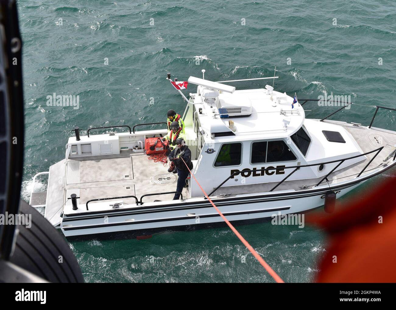 Boat crew members from the Ontario Provincial Police and the Royal ...