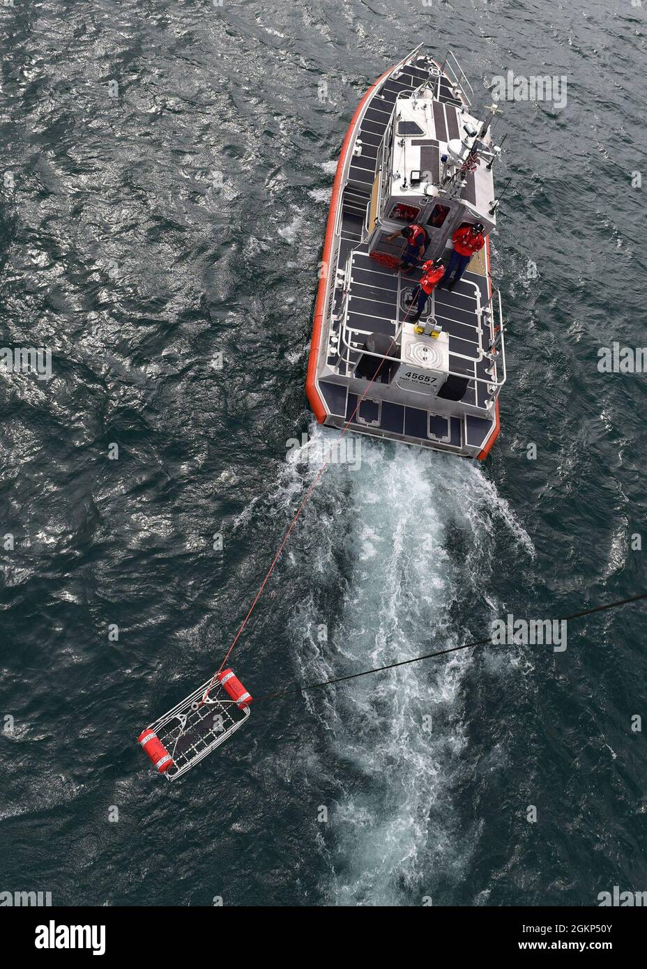 Air crew members from Air Station Traverse City, Mich., recover a ...