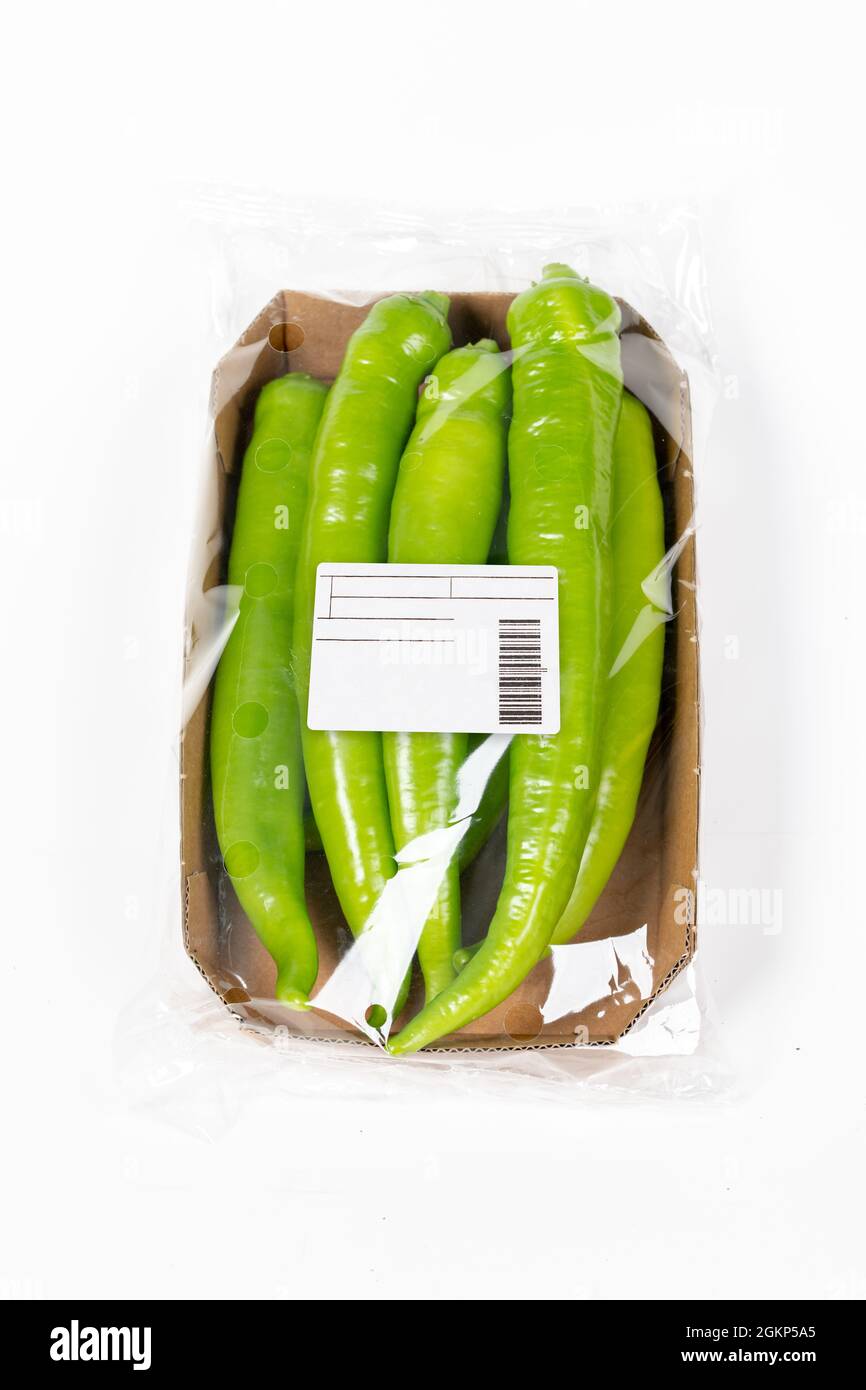Green Mexican pepper packed and labeled on white background Stock Photo ...