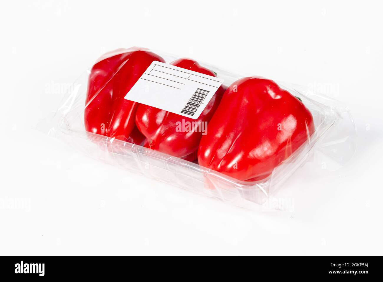3 red bell pepper packed and labeled on white background Stock Photo ...