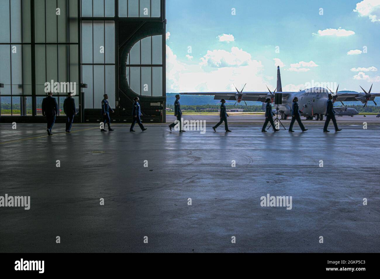 Airmen of each enlisted rank line up to light ceremonial candles during ...