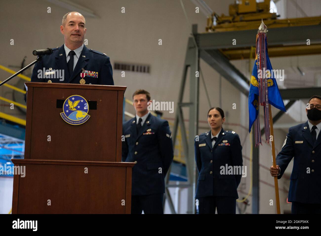 Lt. Col. Daniel Bunch, left, gives a speech after receiving a ...