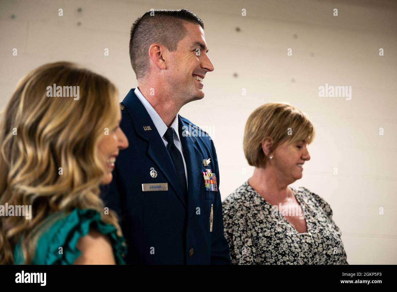 Lt. Col. Samuel Graham, center, socializes with family members during ...
