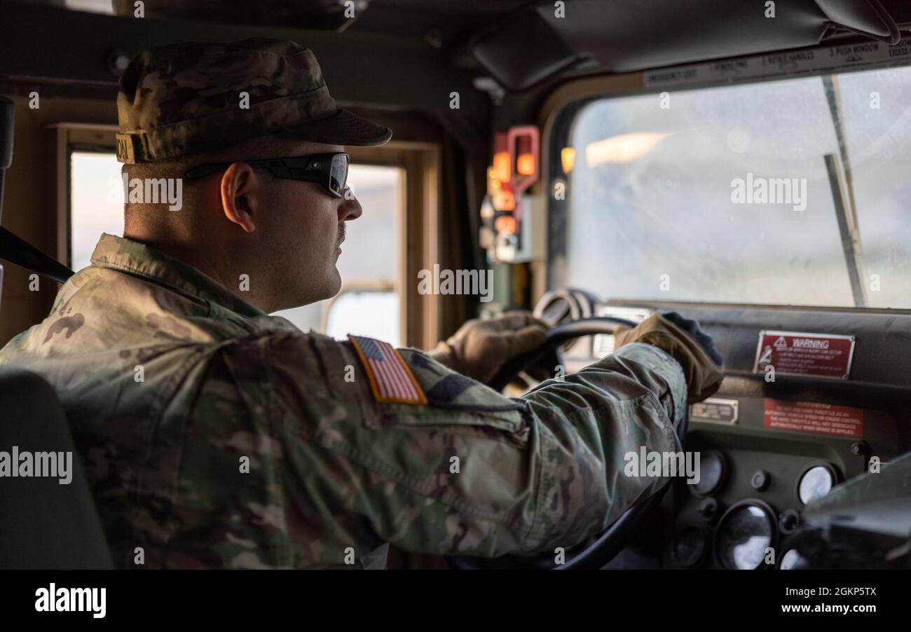 A Soldier drives a humvee as part of his annual drivers training at ...