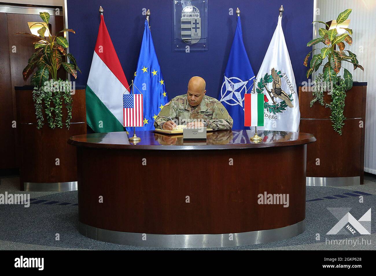 Maj. Gen. John C. Harris Jr. (left), Ohio adjutant general, signs a ...