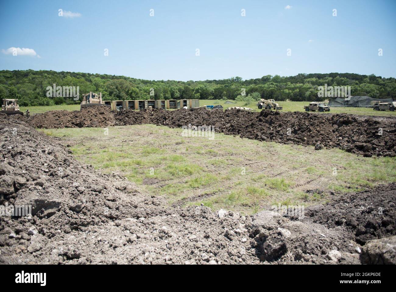 Engineers from the 61st Quartermaster Battalion excavate the terrain as ...