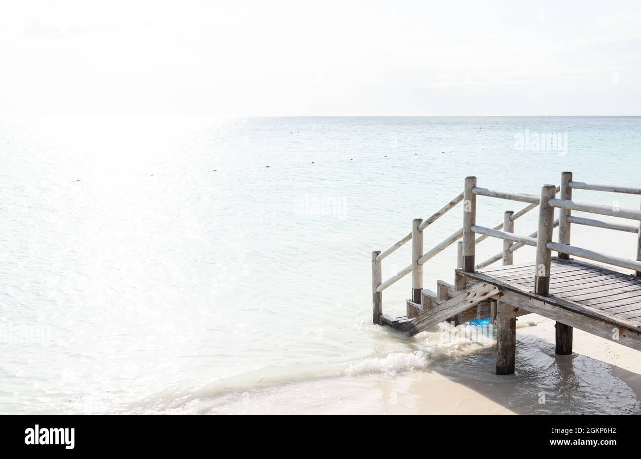 Beautiful tropical steps into turquoise sea water Stock Photo - Alamy