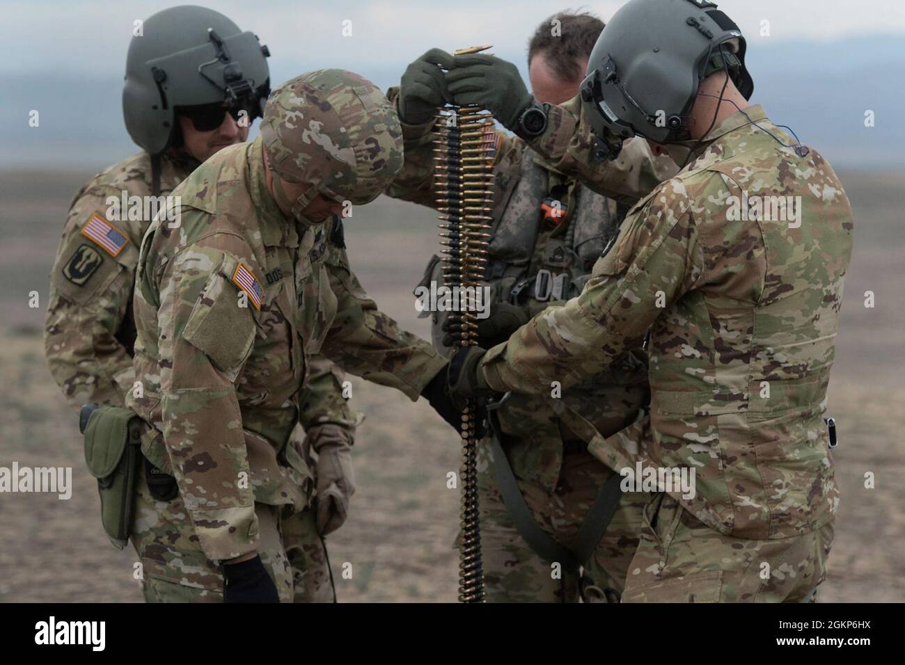 Soldiers from the 183rd Helicopter Assault Battalion prepare ammunition ...