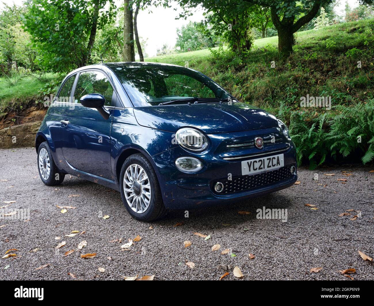 Blue Fiat 500 hybrid parked in a private driveway Stock Photo - Alamy