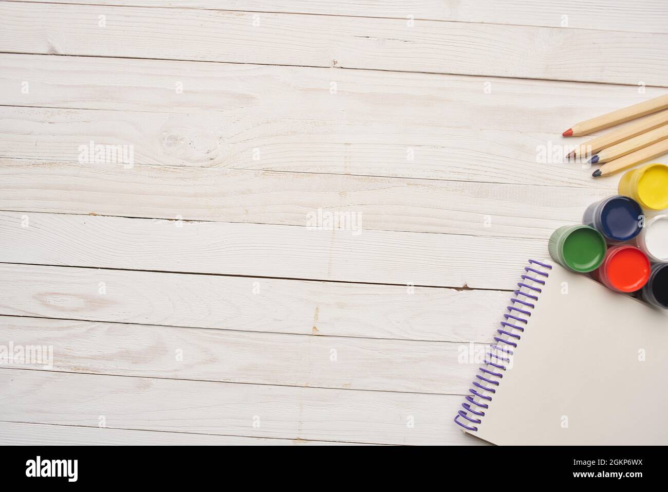 watercolor paint notepad painting tools wooden background Stock Photo ...