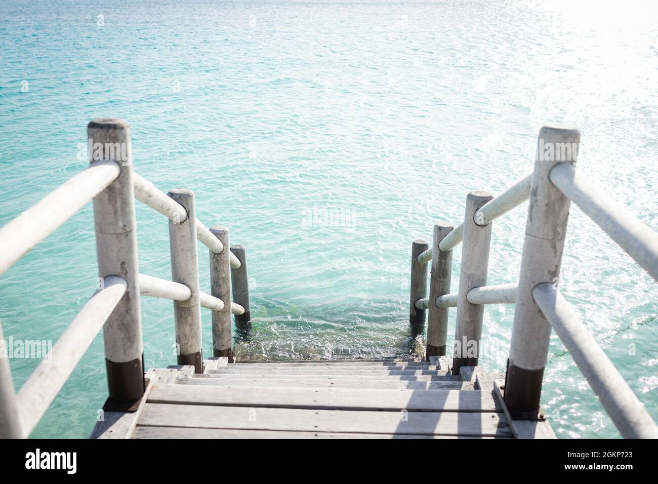 Beautiful tropical steps into turquoise sea water Stock Photo - Alamy