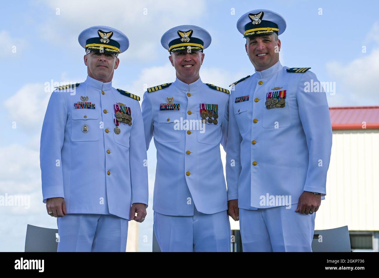 Capt. Michael Paradise, center, commanding officer of the Base New ...