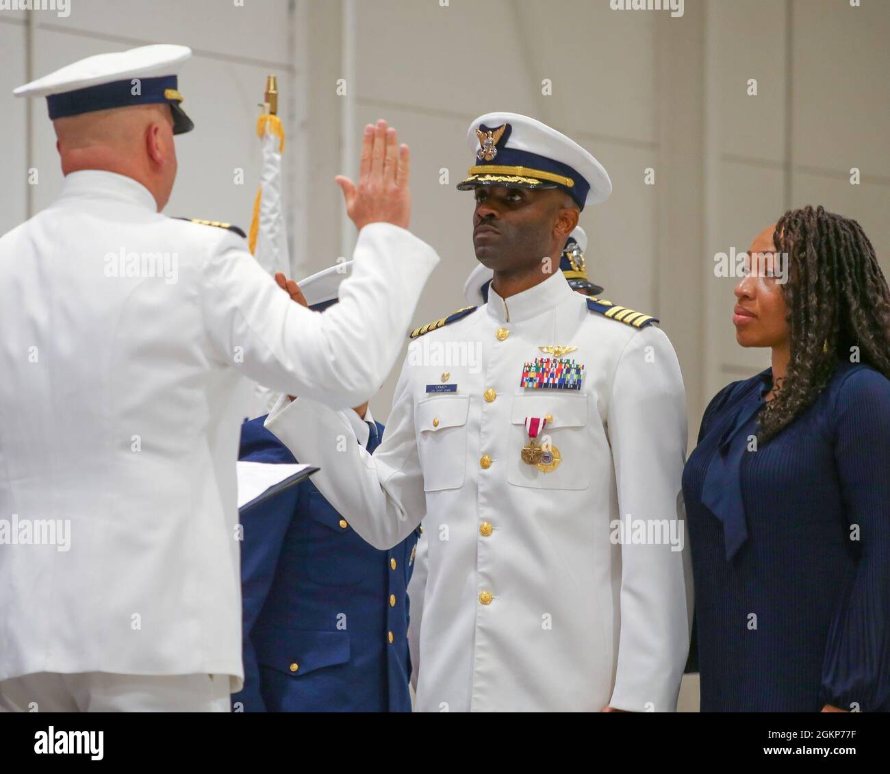 Coast Guard Eighth District Chief of Staff Capt. John Reed frocks the ...