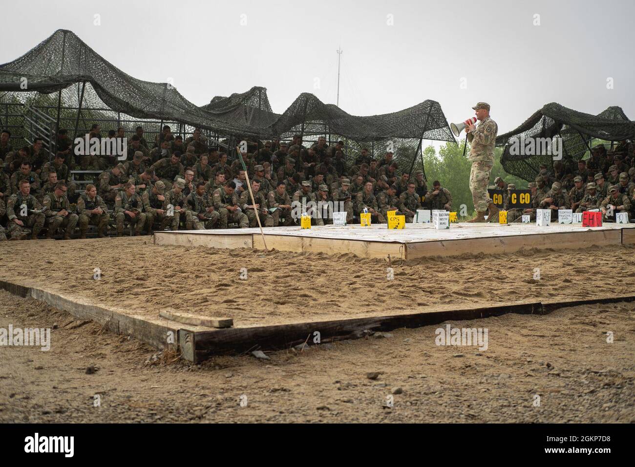 A Cadre member briefs Cadets during a daytime land navigation course ...
