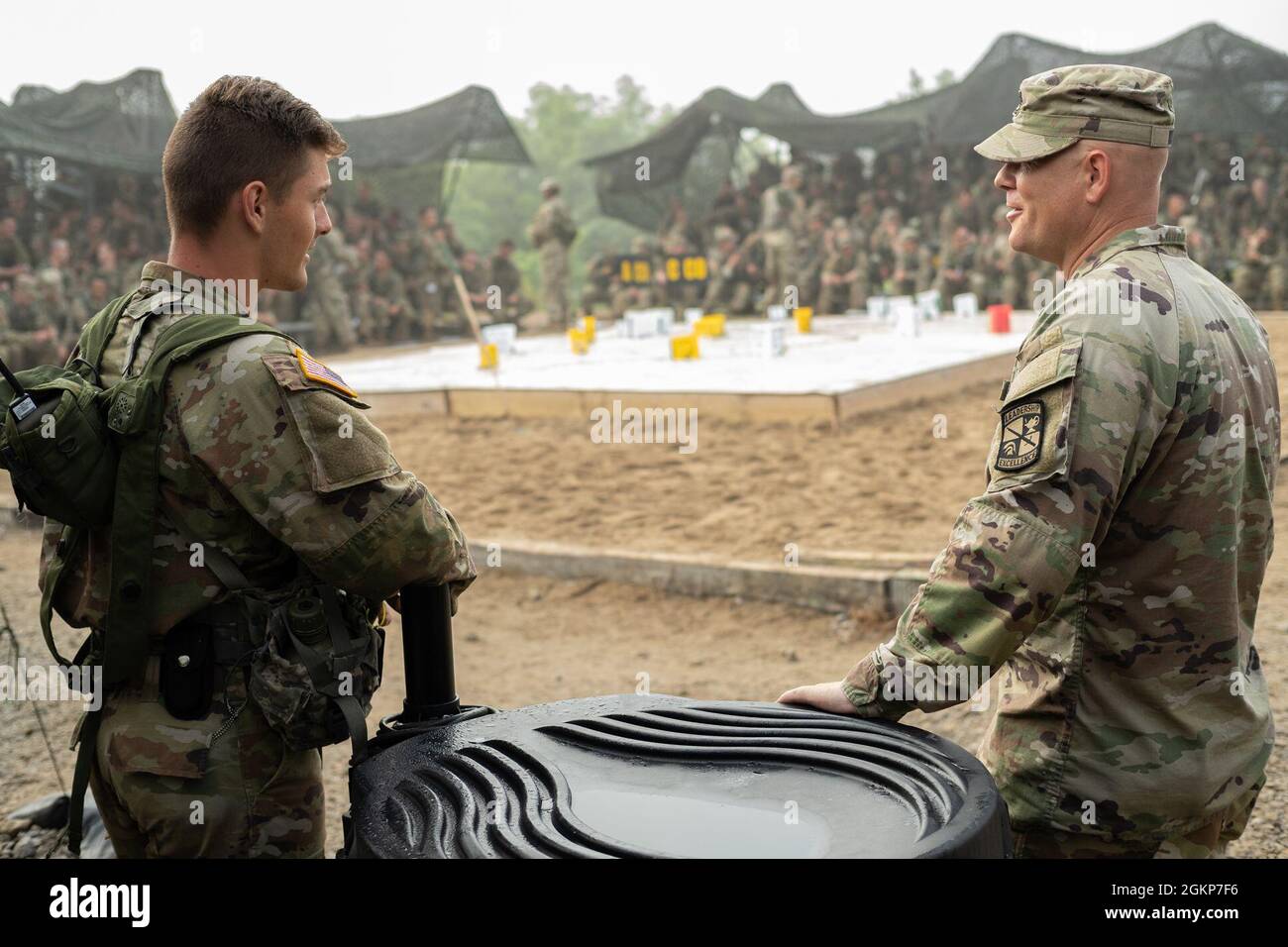 A Cadet talks to a Cadre member during a daytime land navigation course ...
