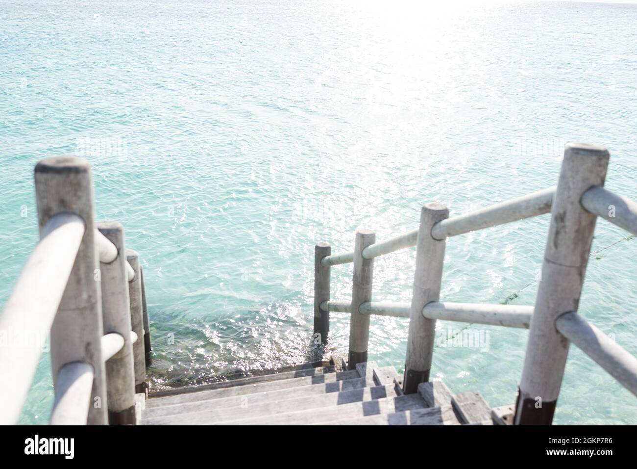 Beautiful tropical steps into turquoise sea water Stock Photo - Alamy