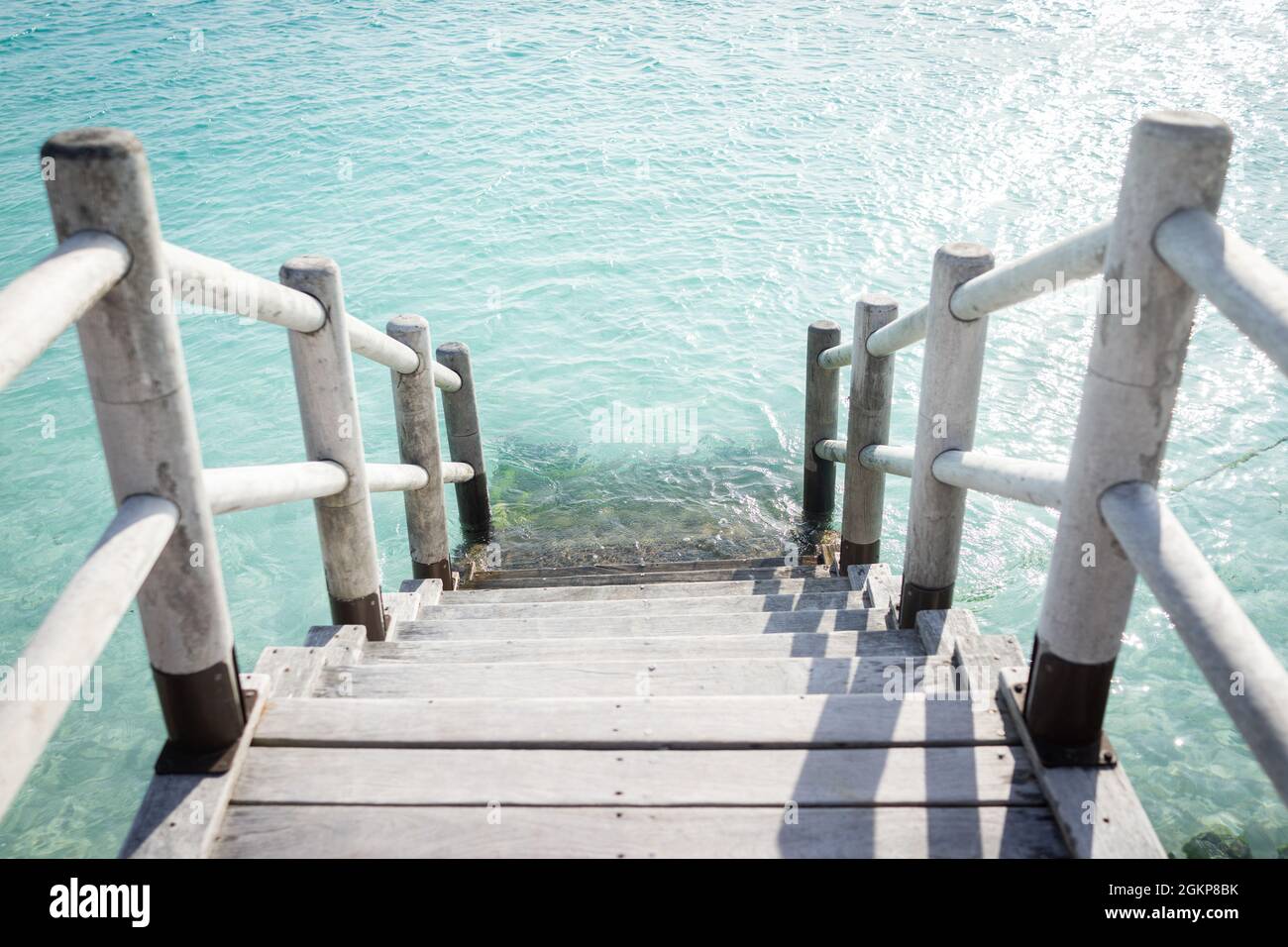 Beautiful tropical steps into turquoise sea water Stock Photo - Alamy