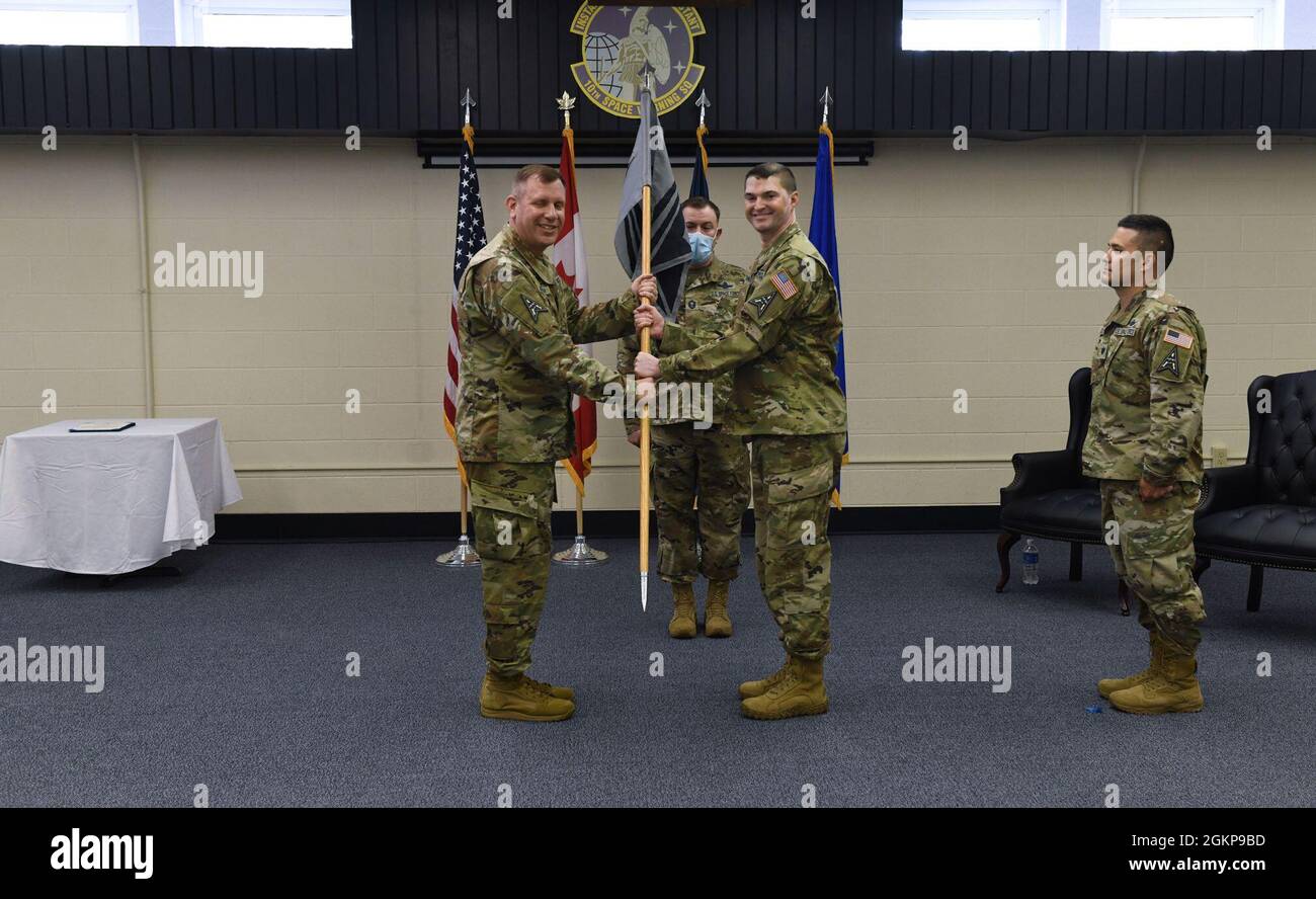 Col. Richard Bourquin, Space Delta 4 commander, passes the guidon to Lt ...