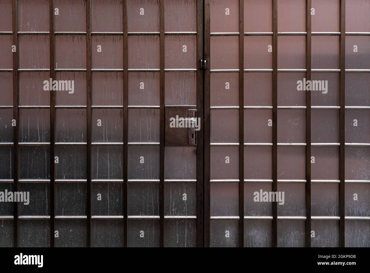 Secure and sturdy metal grid and door Stock Photo - Alamy