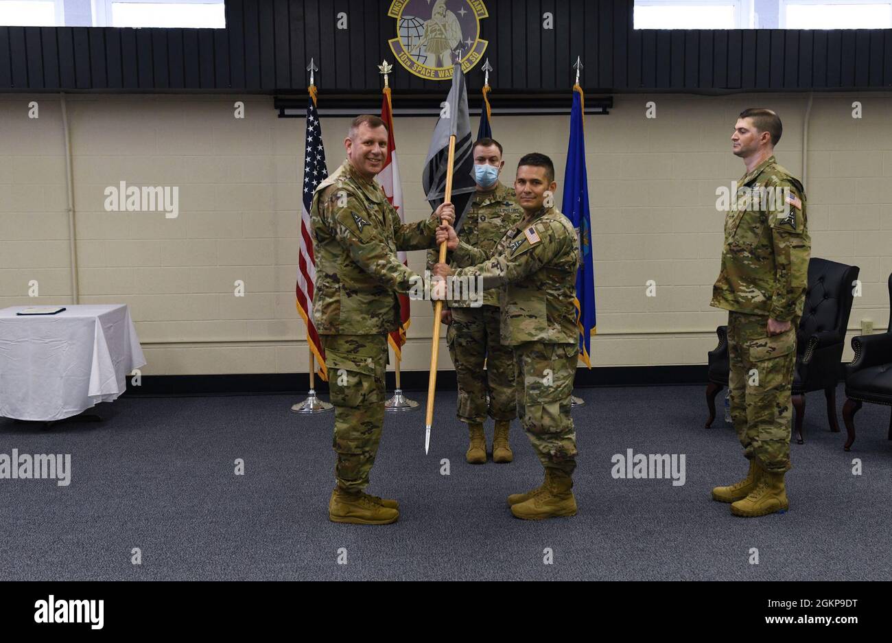 Col. Richard Bourquin, Space Delta 4 commander, receives the guidon ...
