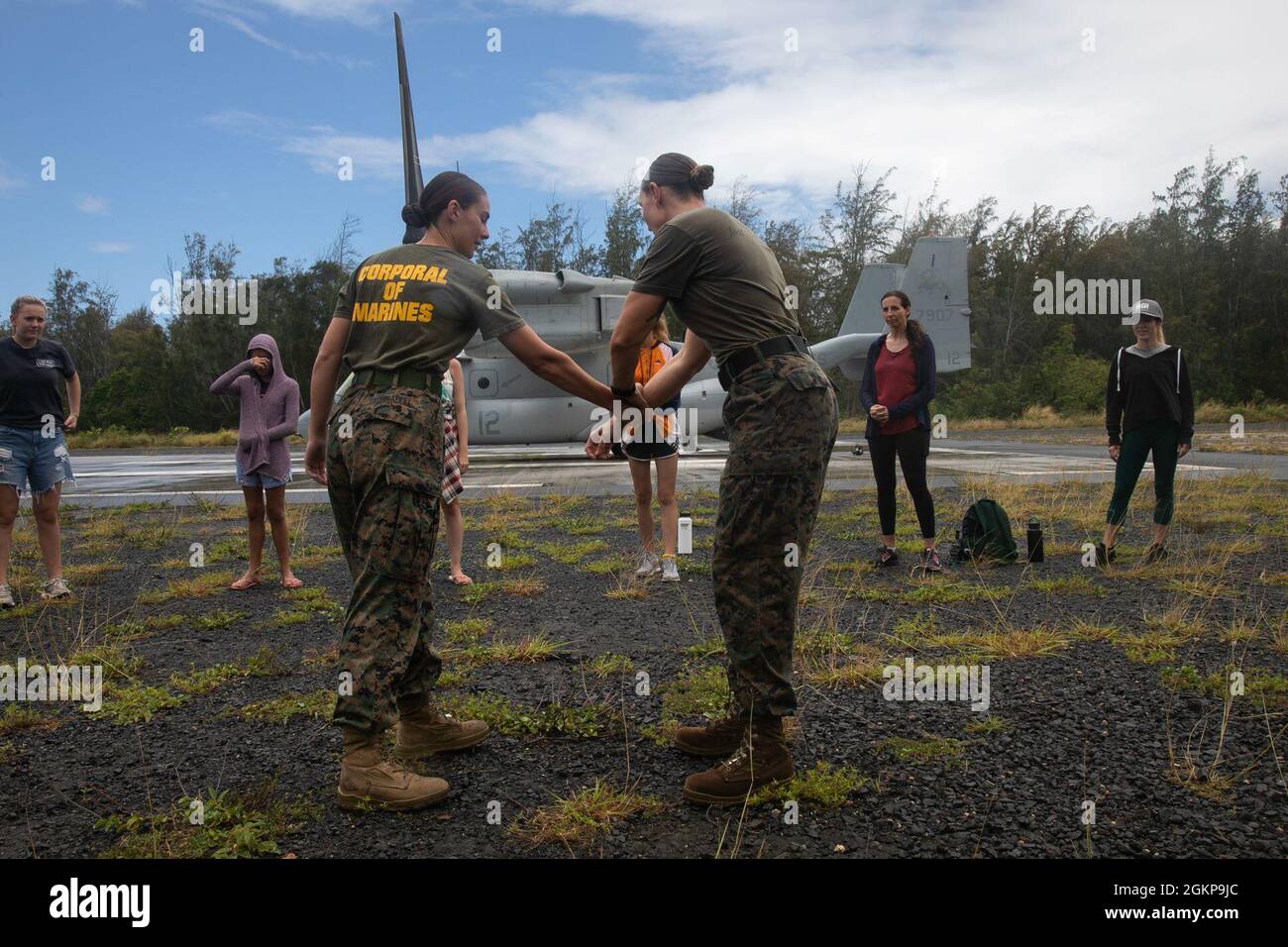U.S. Marine Corps Cpl. Rachel Frohnapfel, left, an administrative ...