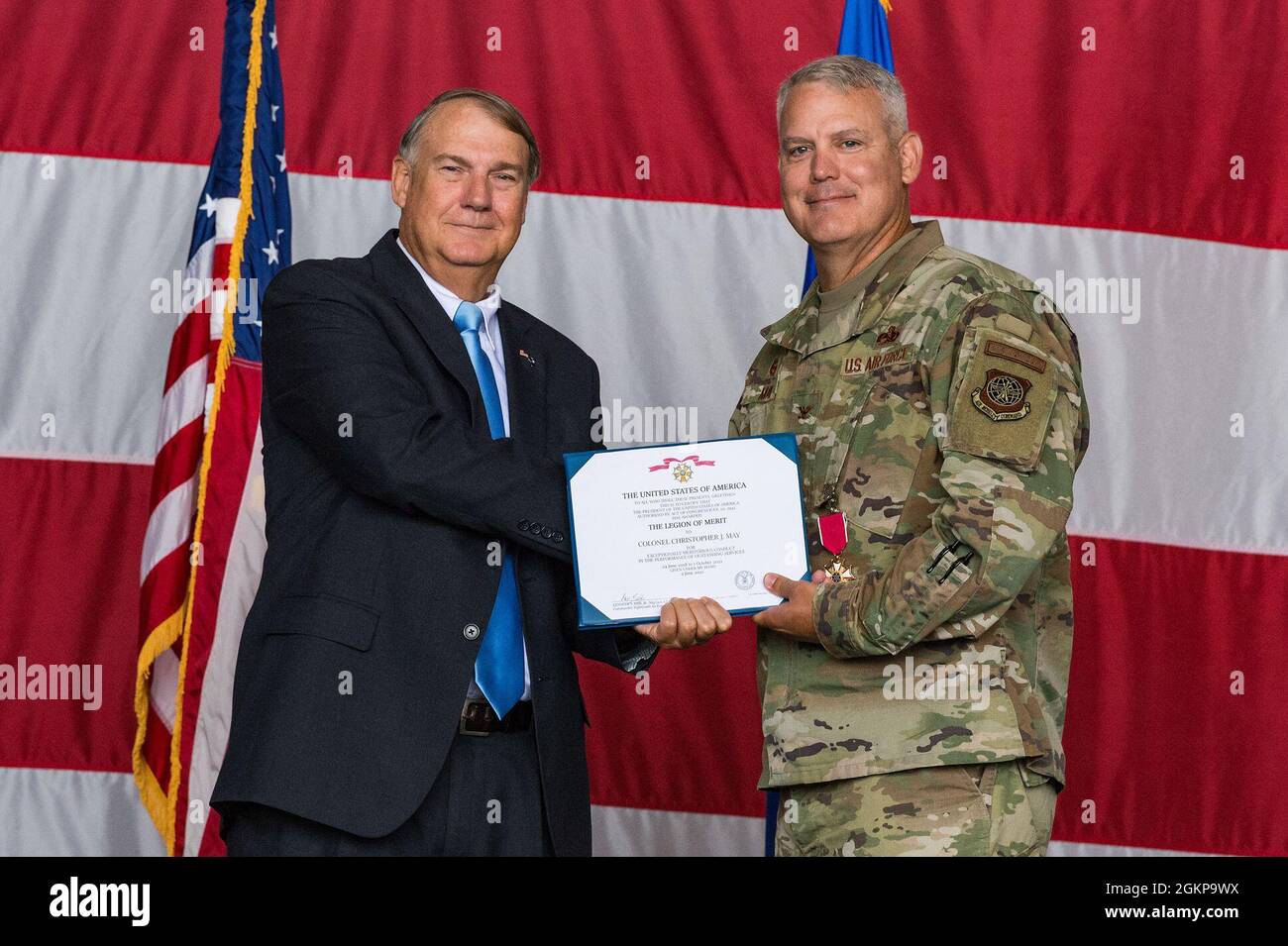 Retired Air Force Col. Norman Moore, left, and Col. Christopher May ...