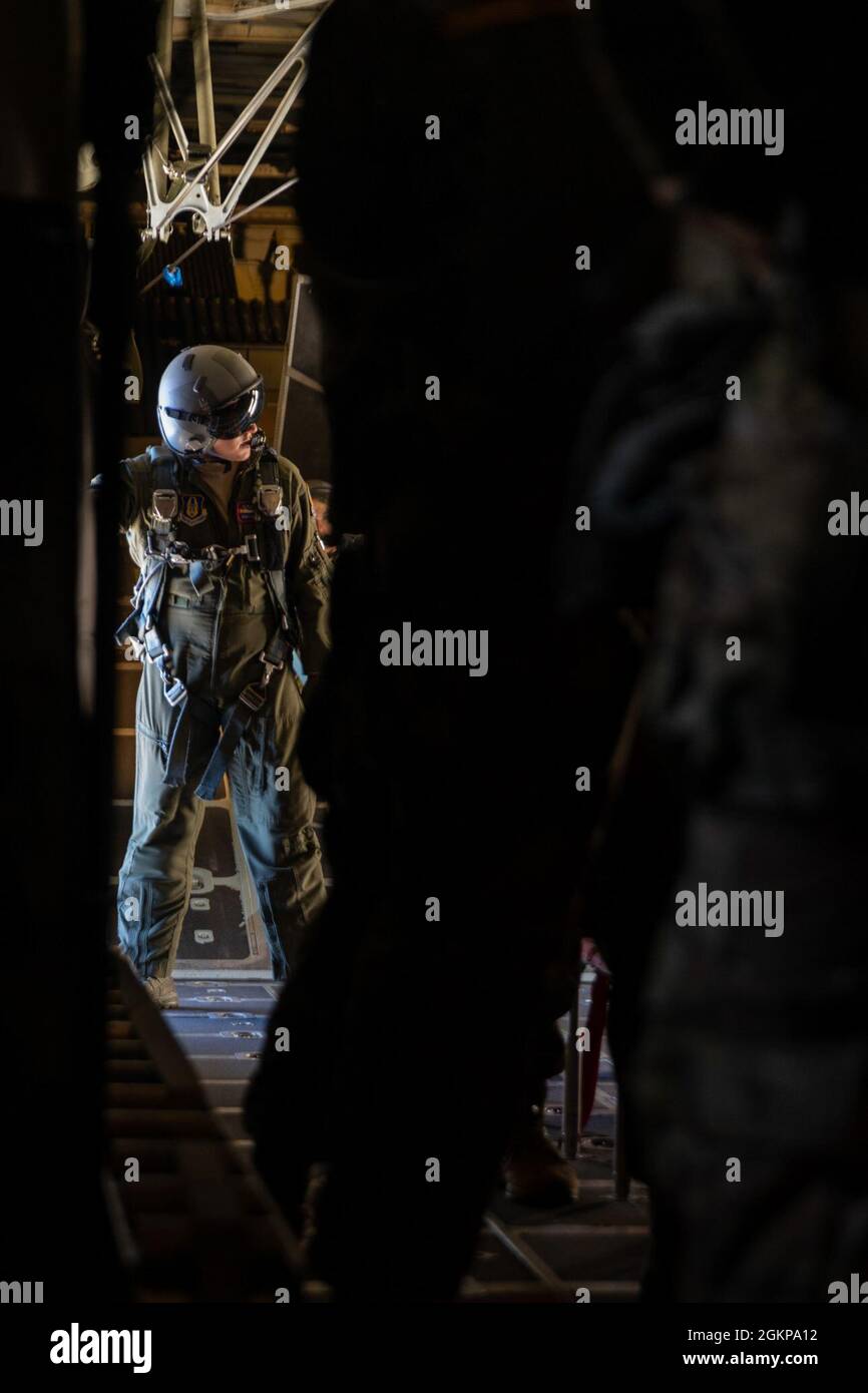 A U.S. Air Force crew chief checks for an all clear during a U.S. Air ...