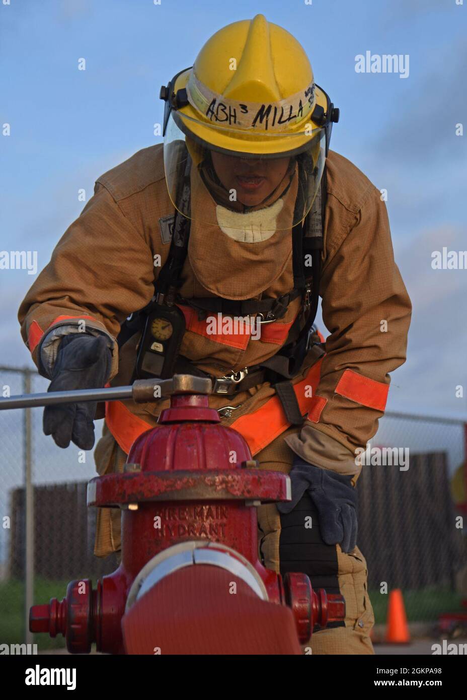 A 312th Training Squadron student operates a fire hydrant at the Louis ...